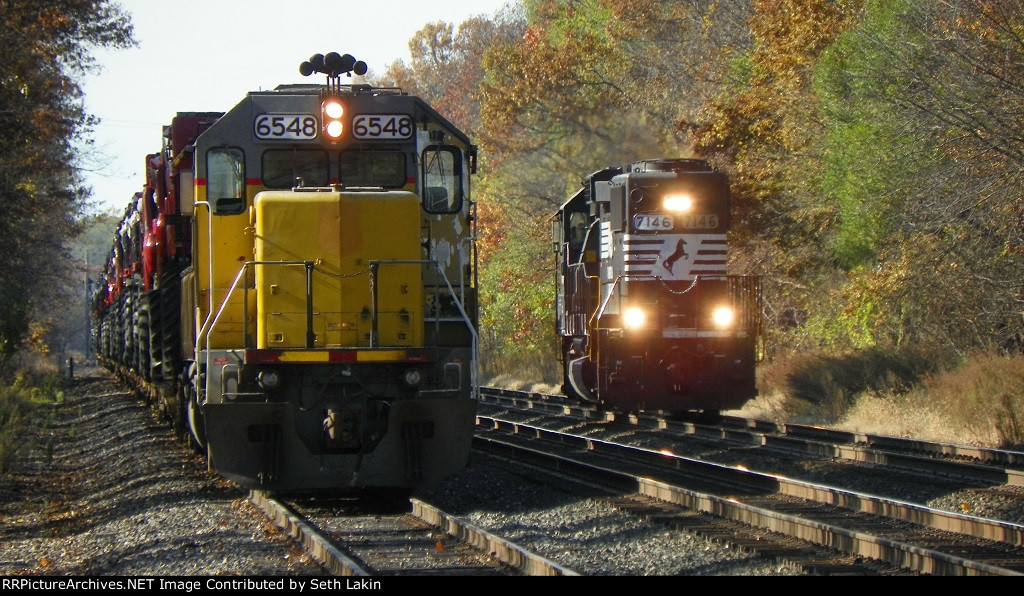 NS 6548 with brand new tractors awating a new paint job in the siding as B01 is on the main